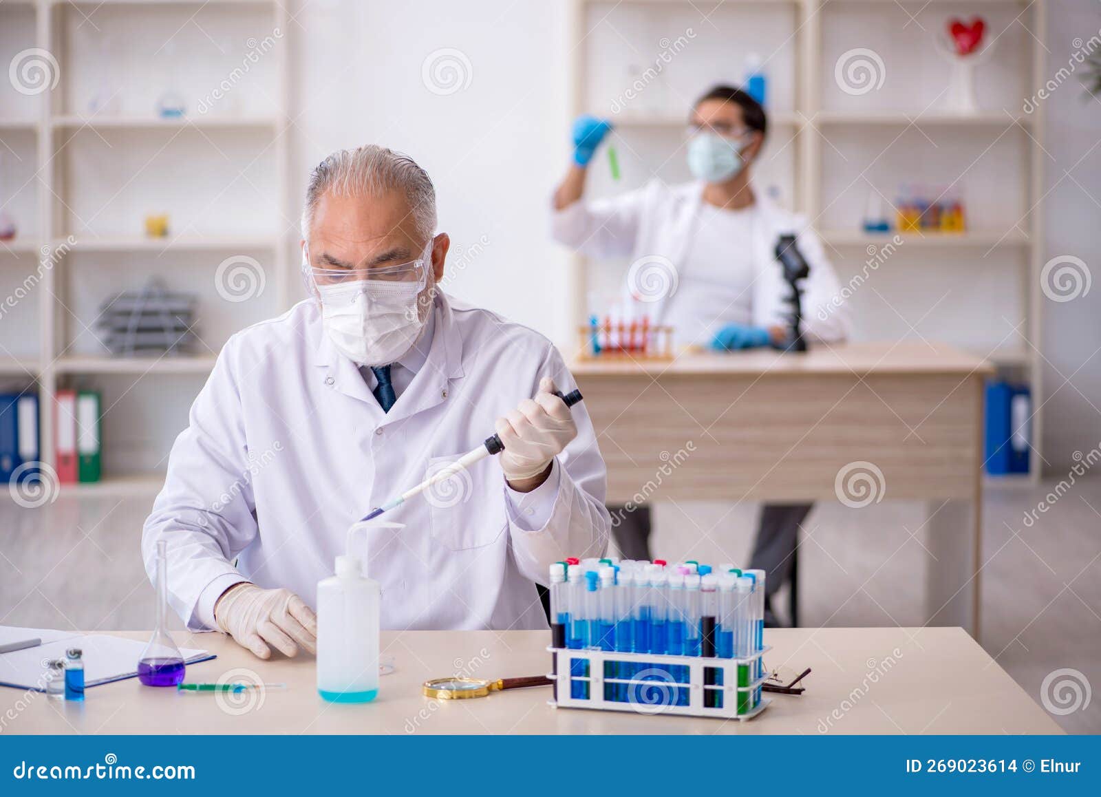Two Male Chemist Working at the Lab Stock Photo - Image of covid, virus ...