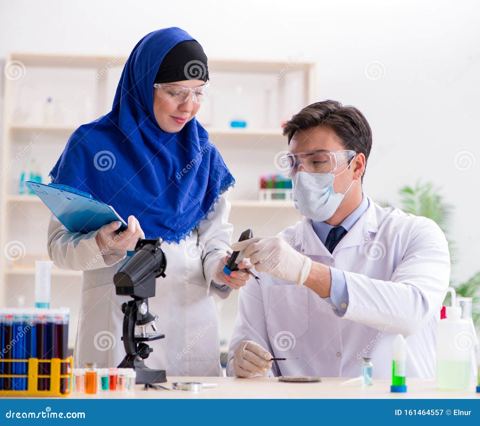 Two Chemists Working in the Lab Stock Image - Image of glass, arabic ...
