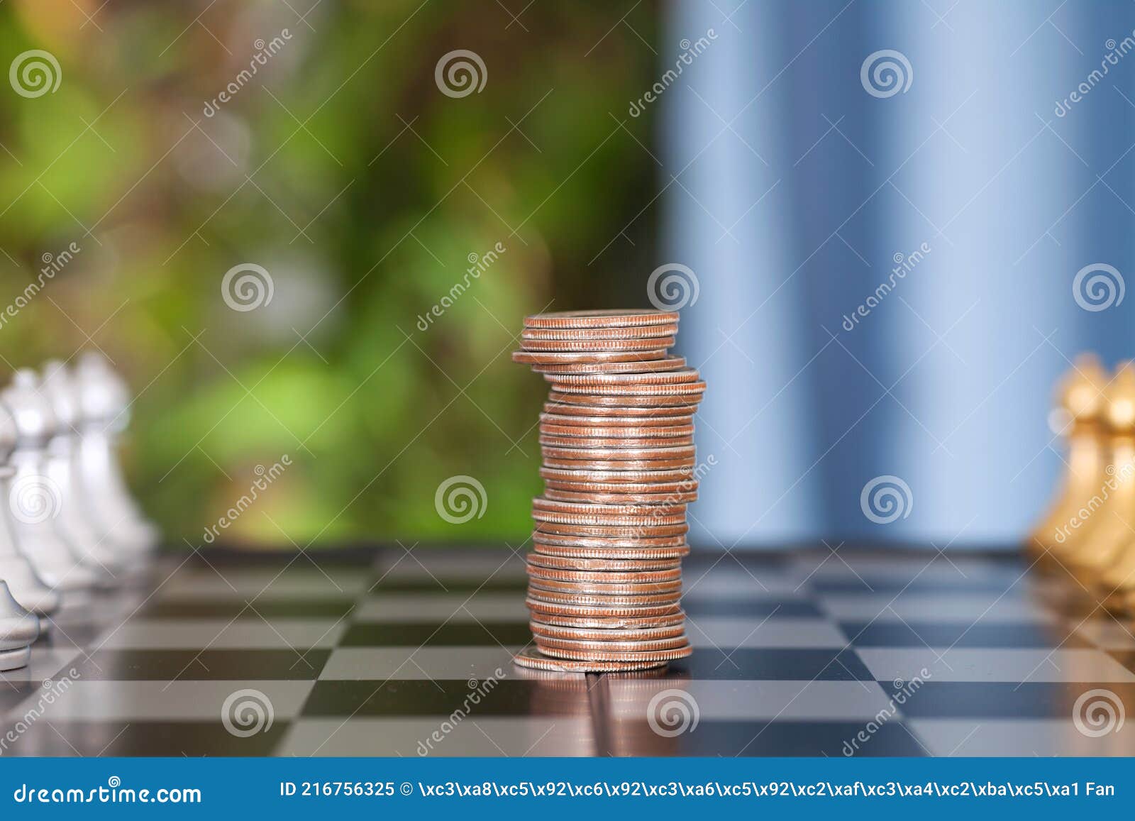 Two Chess Pieces on a Chess Board and a Stack of Dollar Coins in the ...