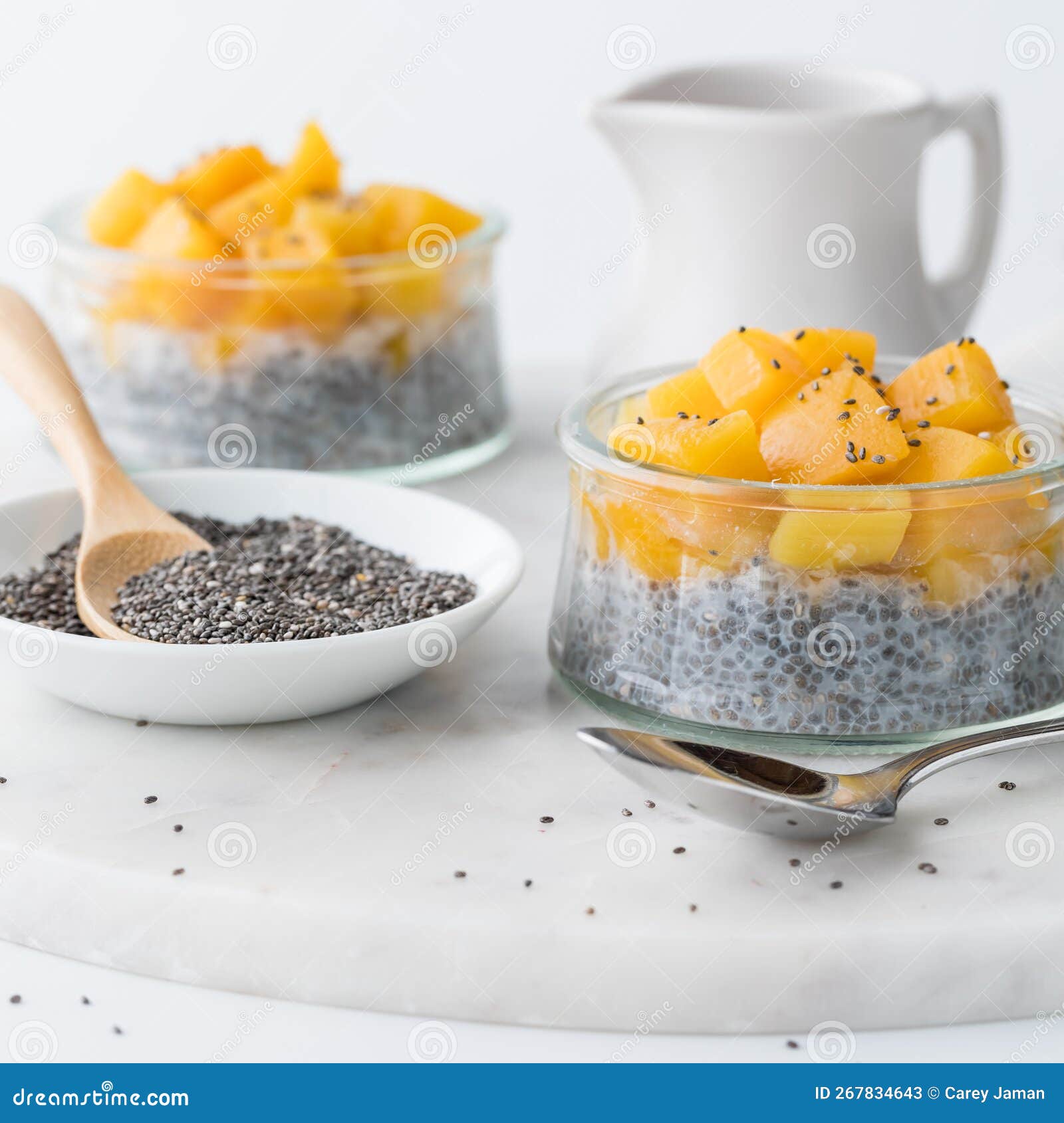 Two Chia Pudding Parfaits Topped with Diced Mangos and a Bowl of Chia ...