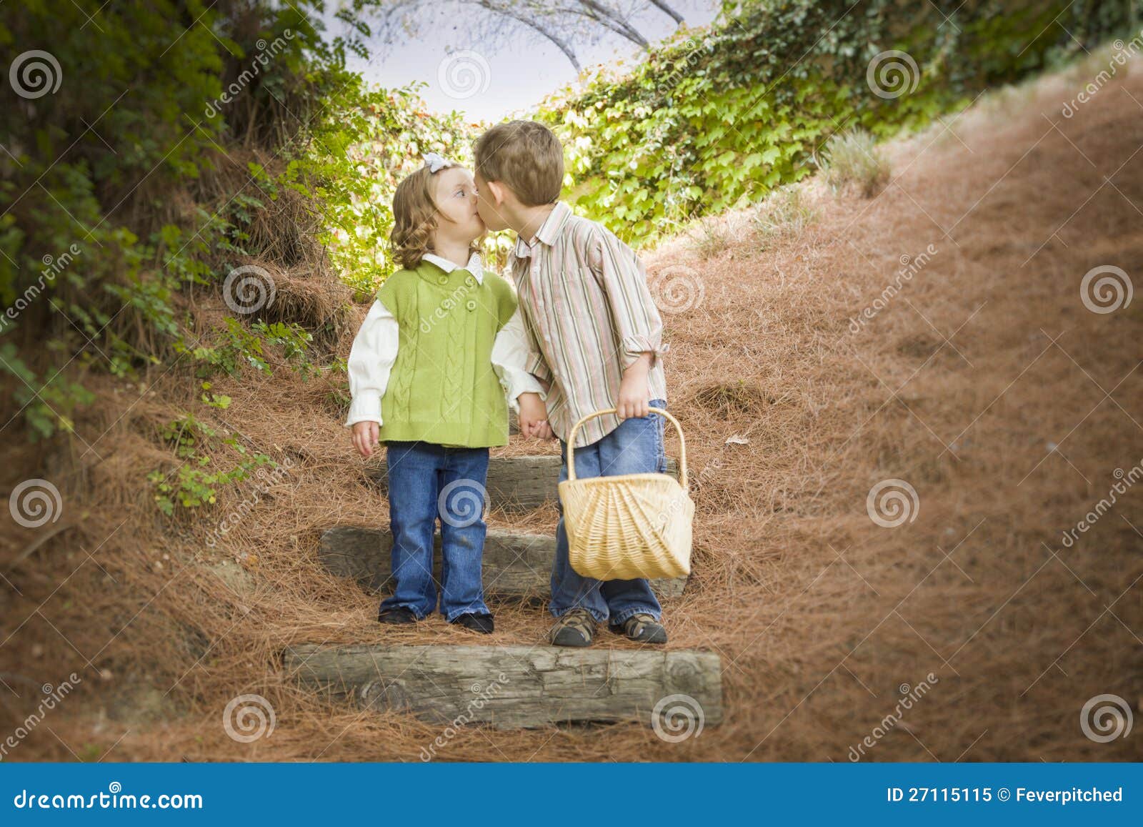 Two Children with Basket Kissing Outside on Steps Stock Image - Image ...