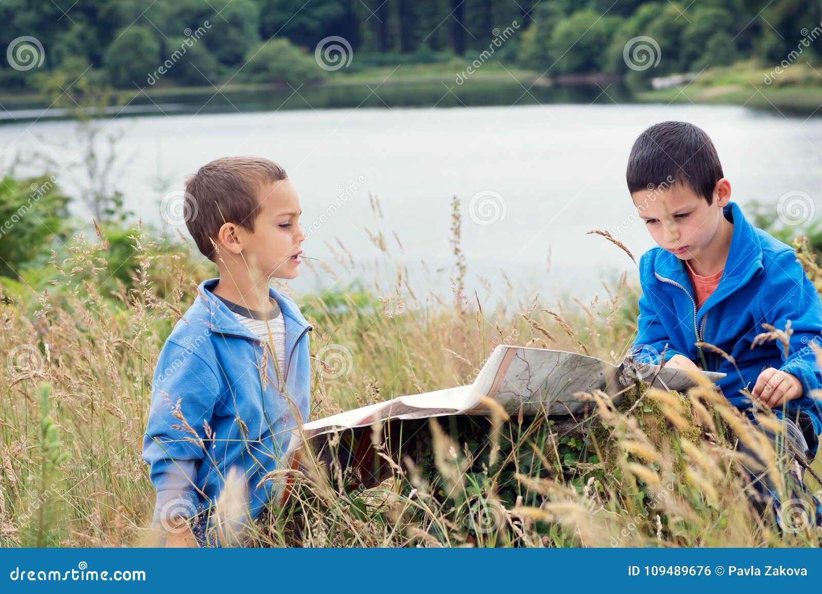 Children Reading a Map in Nature Stock Photo - Image of long, nature ...