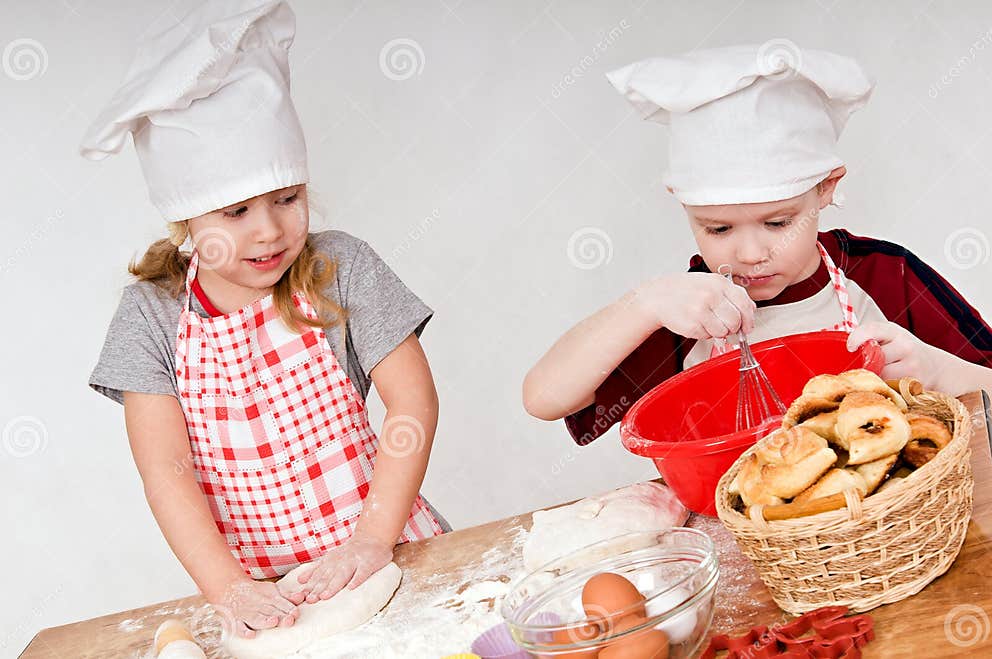 Two children cooks stock photo. Image of baker, childhood - 23974340