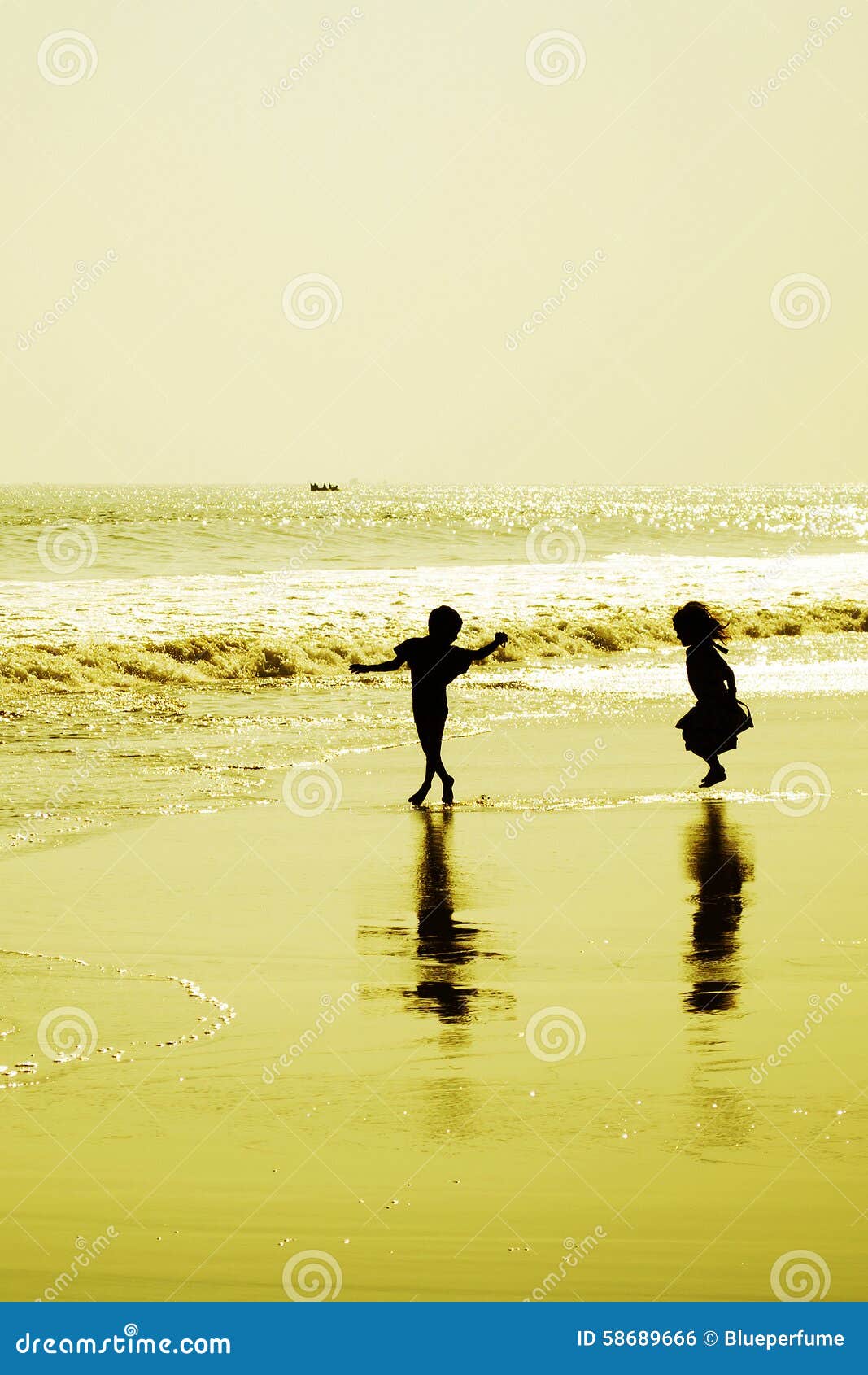 Two Children Dancing on the Beach at Sunset Stock Photo - Image of ...