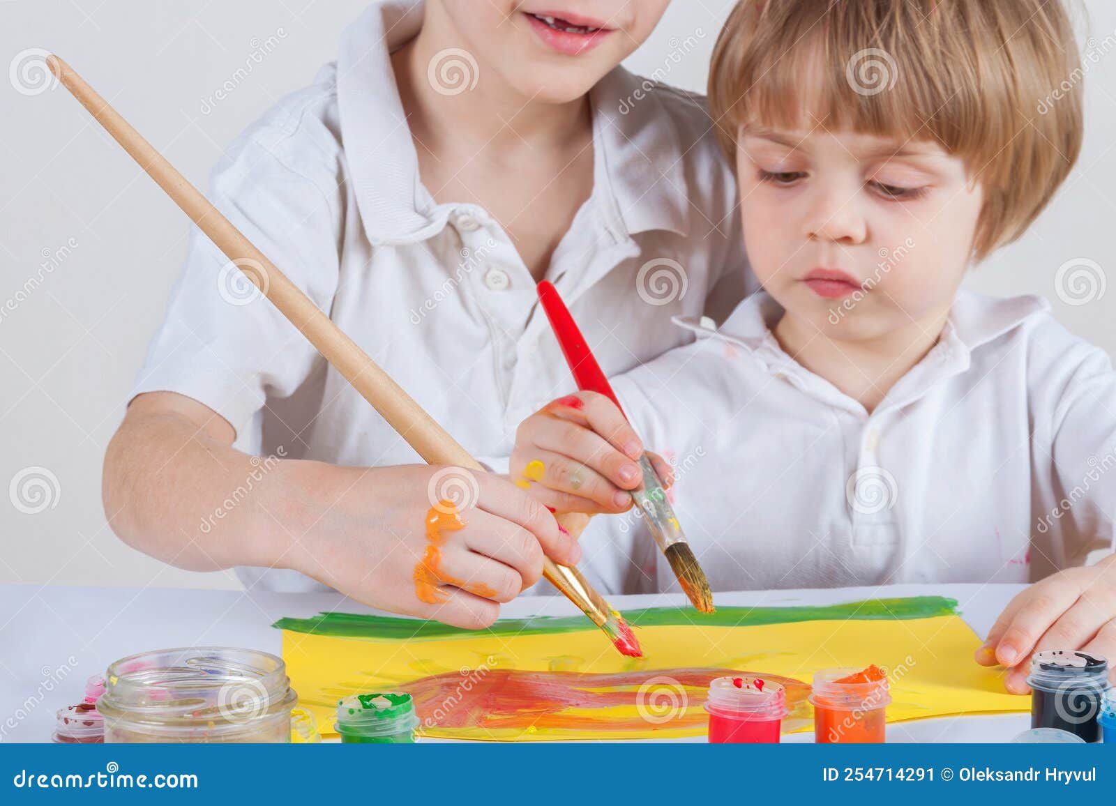 Two Children Draw Together. they Paint in Different Colors Stock Image ...
