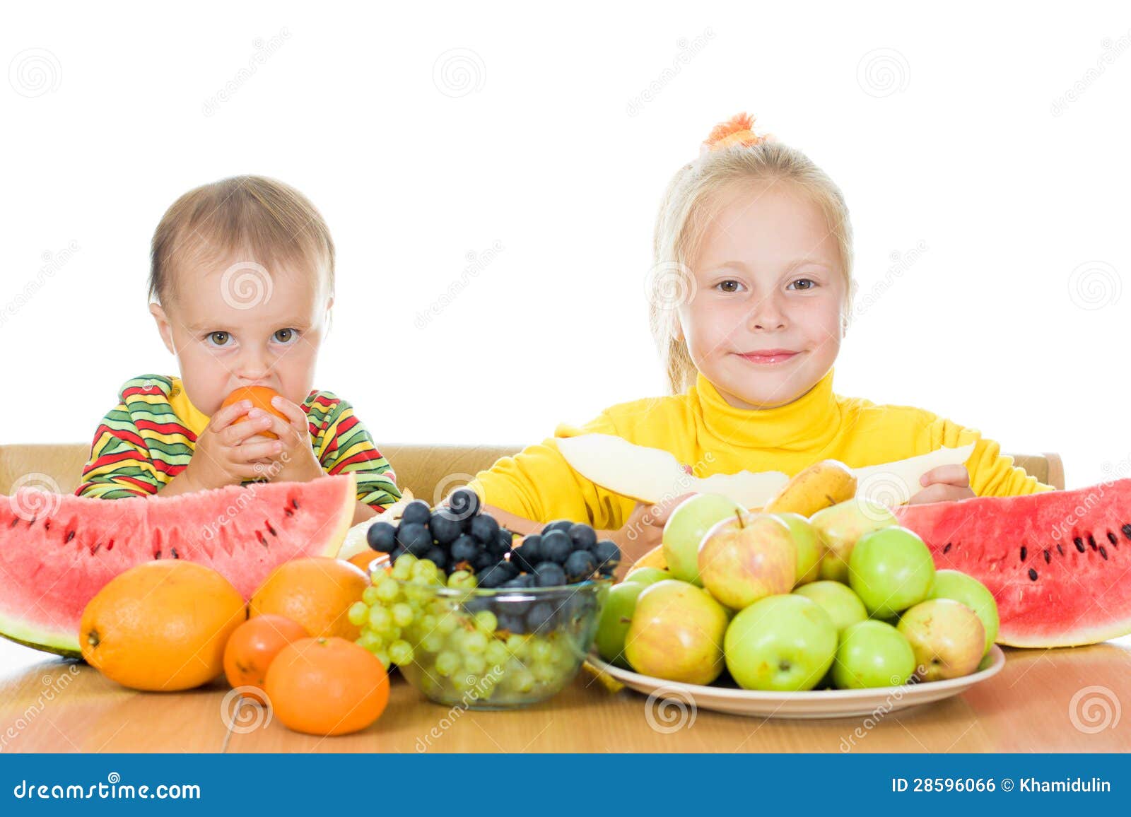 Two Children Eat Fruit At A Table Royalty Free Stock Image - Image ...