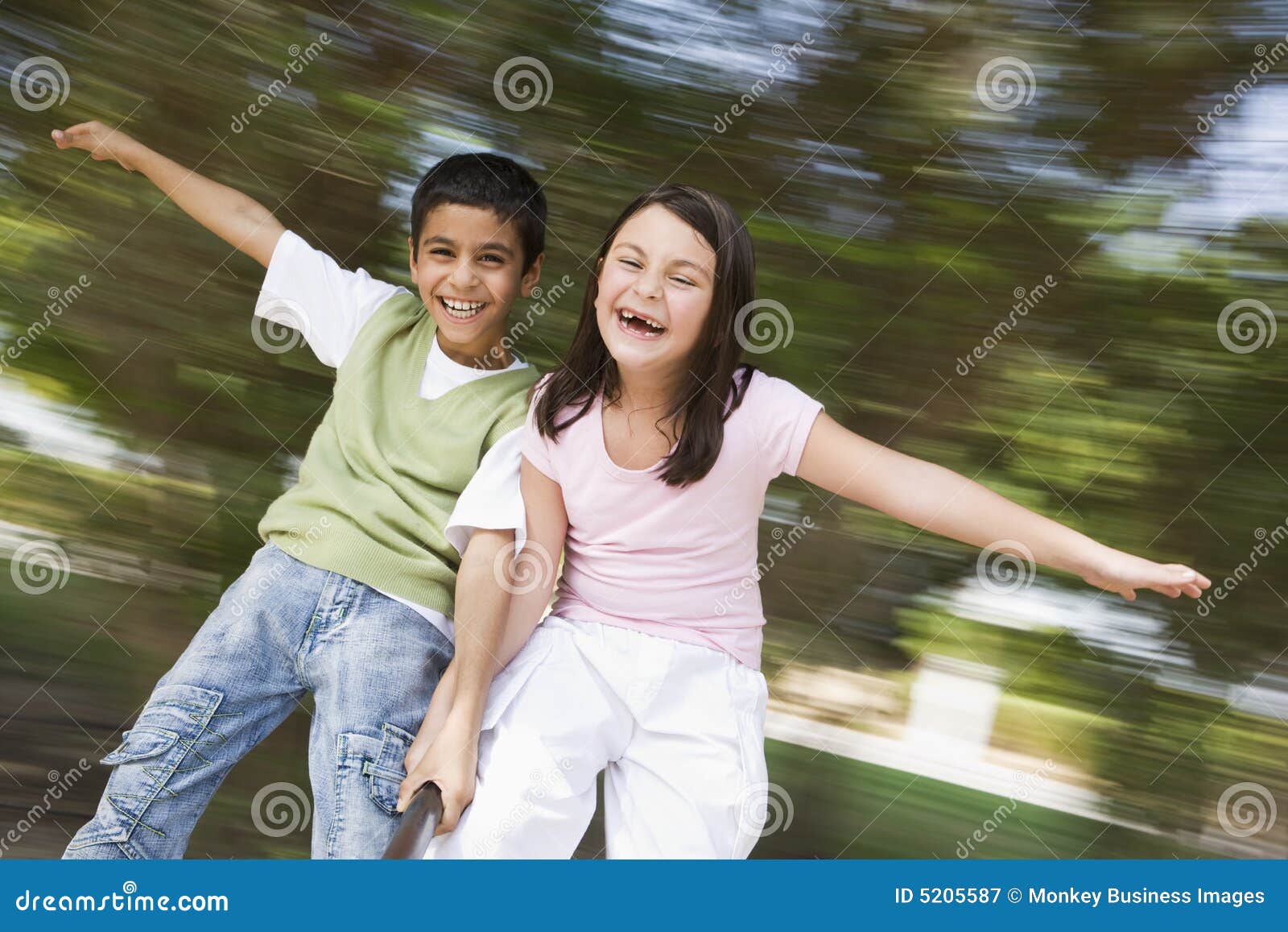 Two Children Having Fun on Roundabout Stock Image - Image of brother ...