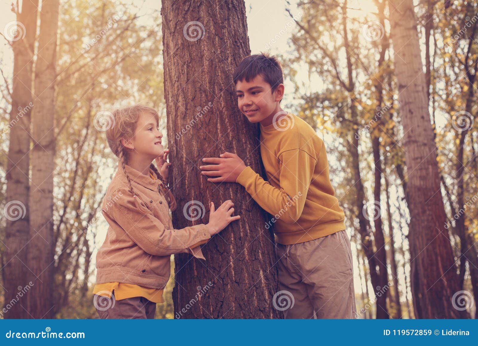 Two children in the park. stock image. Image of elementary - 119572859