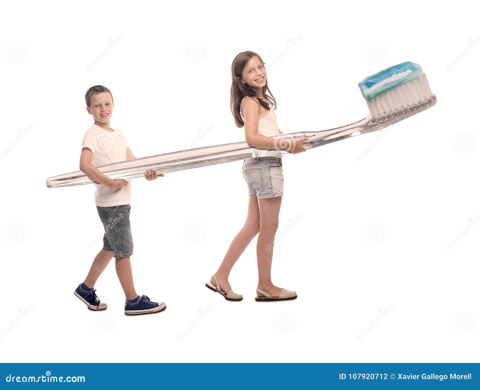 Two Children Holding a Big Toothbrush Stock Photo - Image of freckles ...