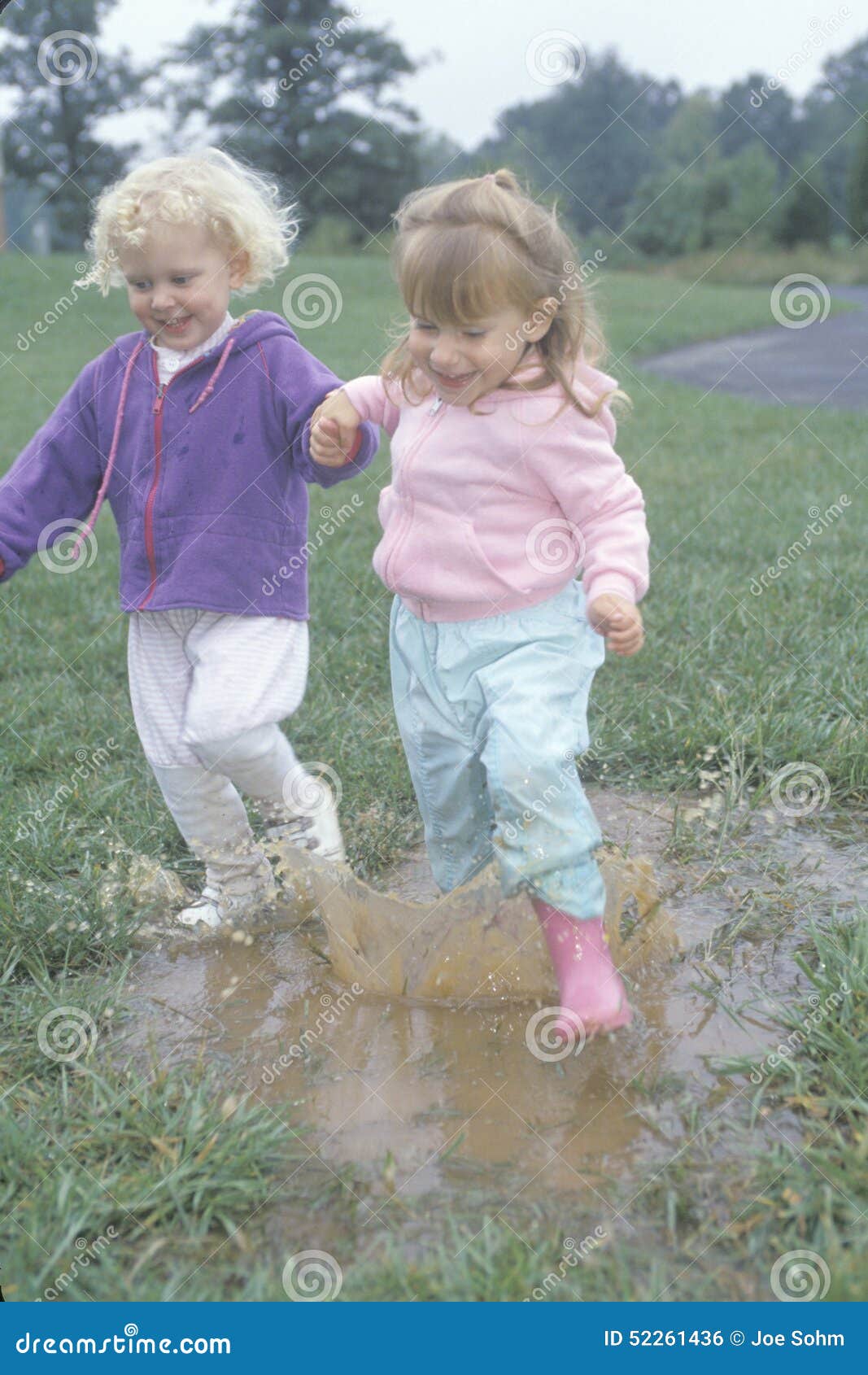 Two Children Jumping Over a Puddle, Washington D.C Editorial Photo ...