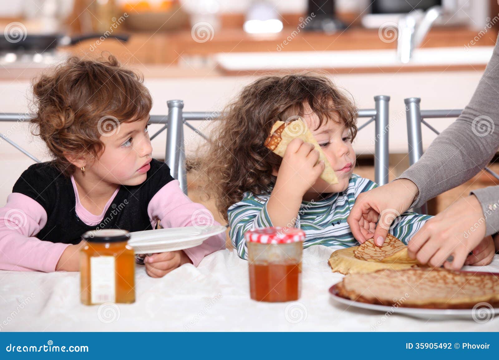 Two Children at Kitchen Table Stock Photo - Image of female, mother ...