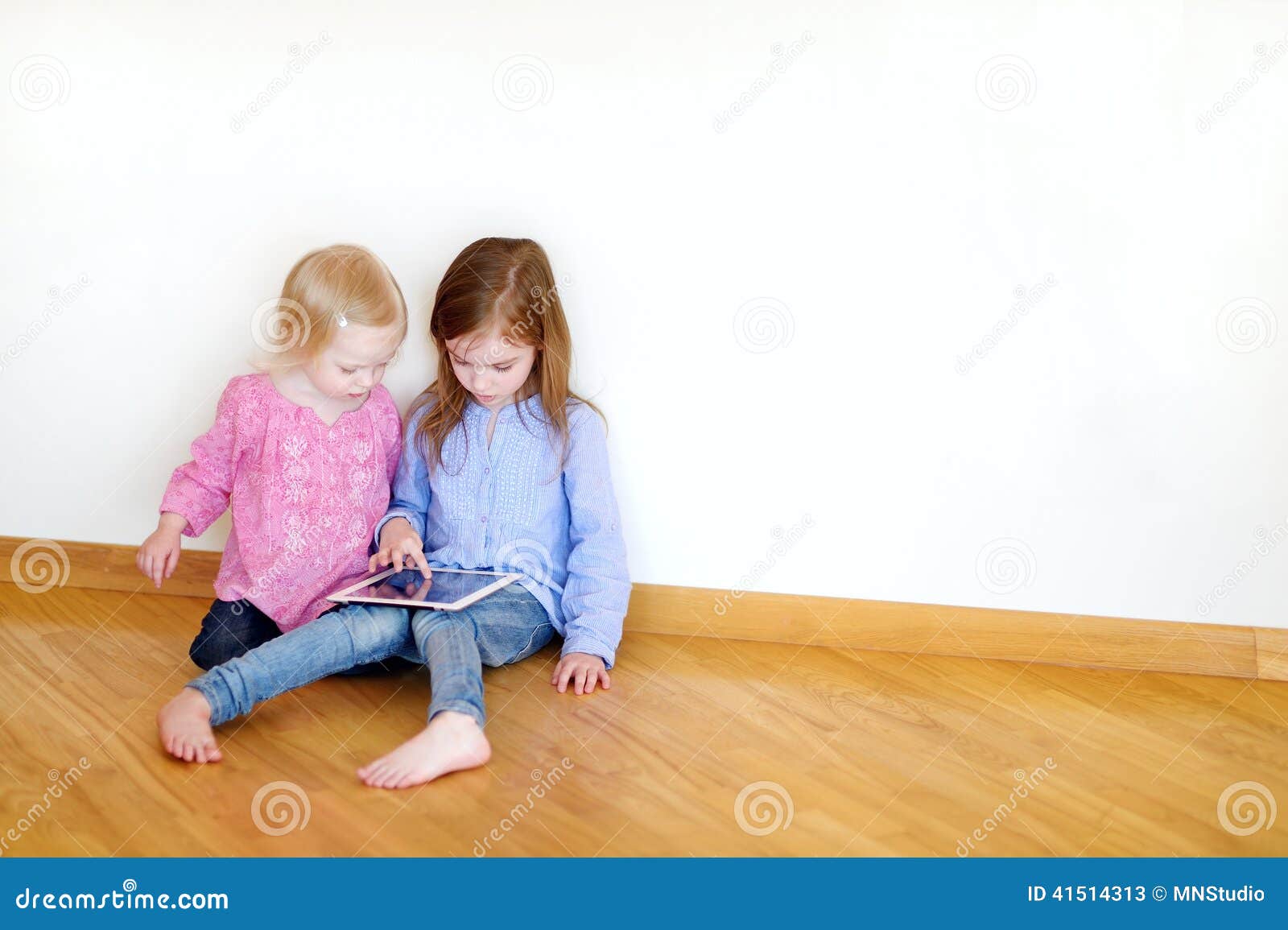 Two Children Playing on a Digital Tablet Stock Image - Image of family ...