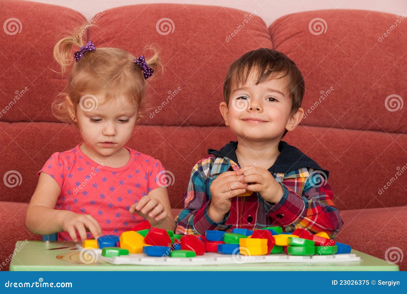 Two Children Playing at the Table Stock Image - Image of activity ...