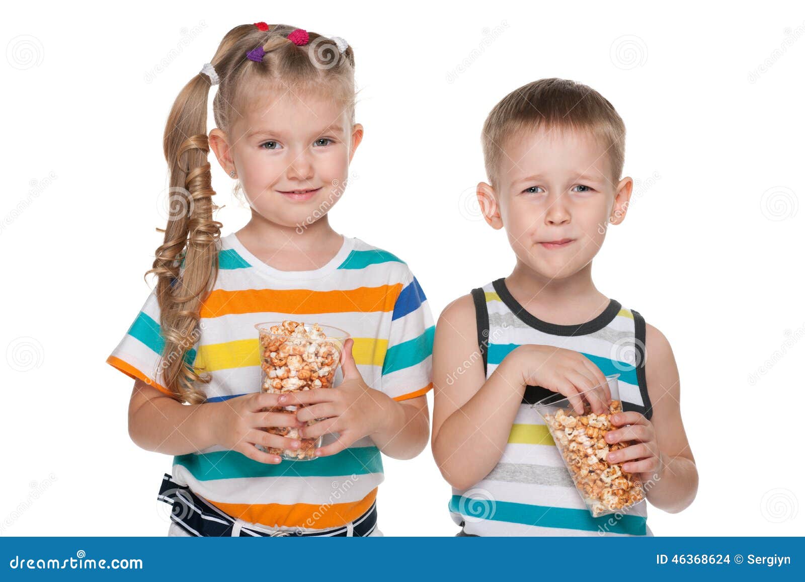 Two children with popcorn stock photo. Image of hold - 46368624