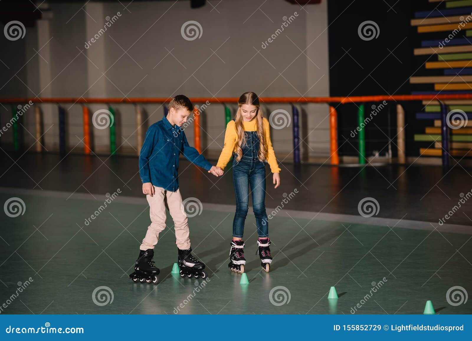 Two Children Practicing Scating on Rollers with Stock Image - Image of ...