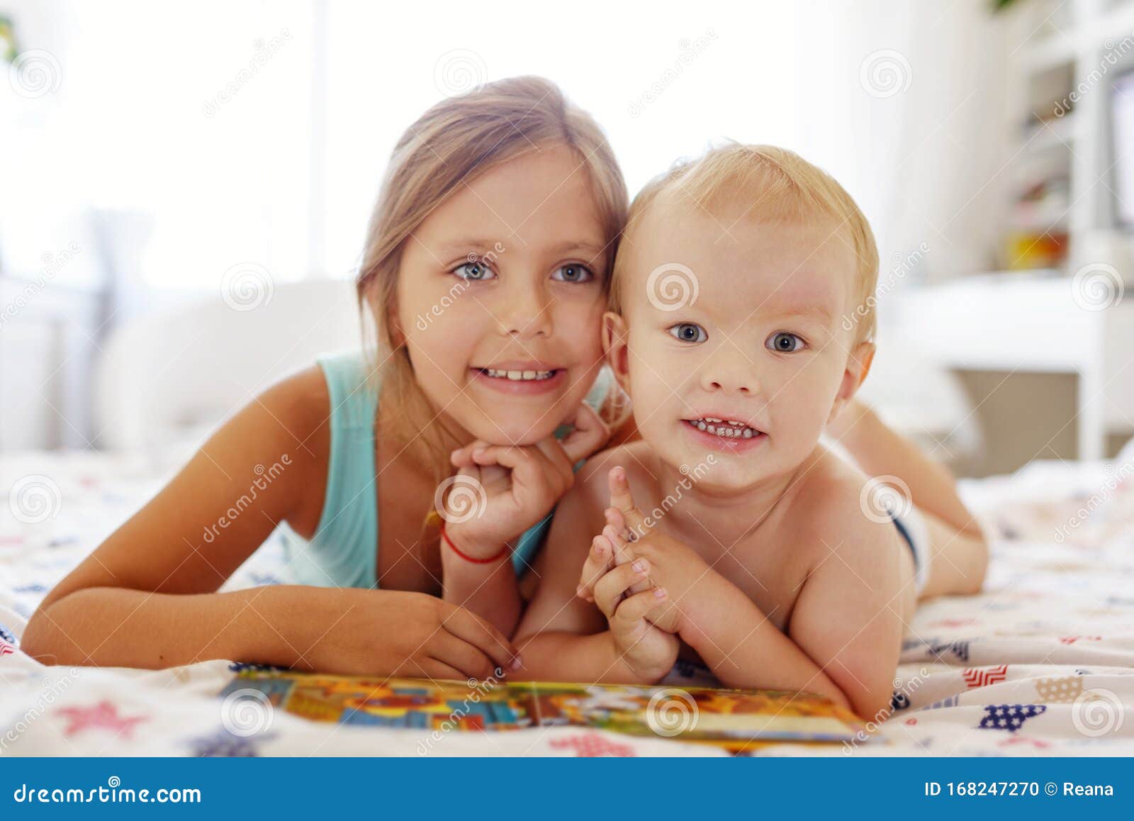Two Children Reading a Book Stock Photo - Image of friends, caucasian ...