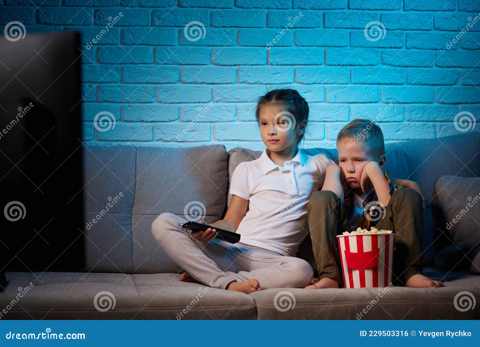 Two Children with Remote Control Watching TV Stock Photo - Image of ...