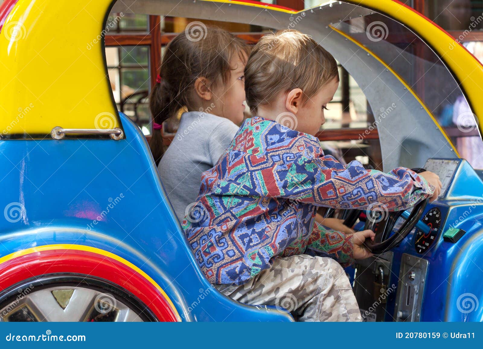 Two Children Riding Toy Car Stock Image - Image of play, smile: 20780159