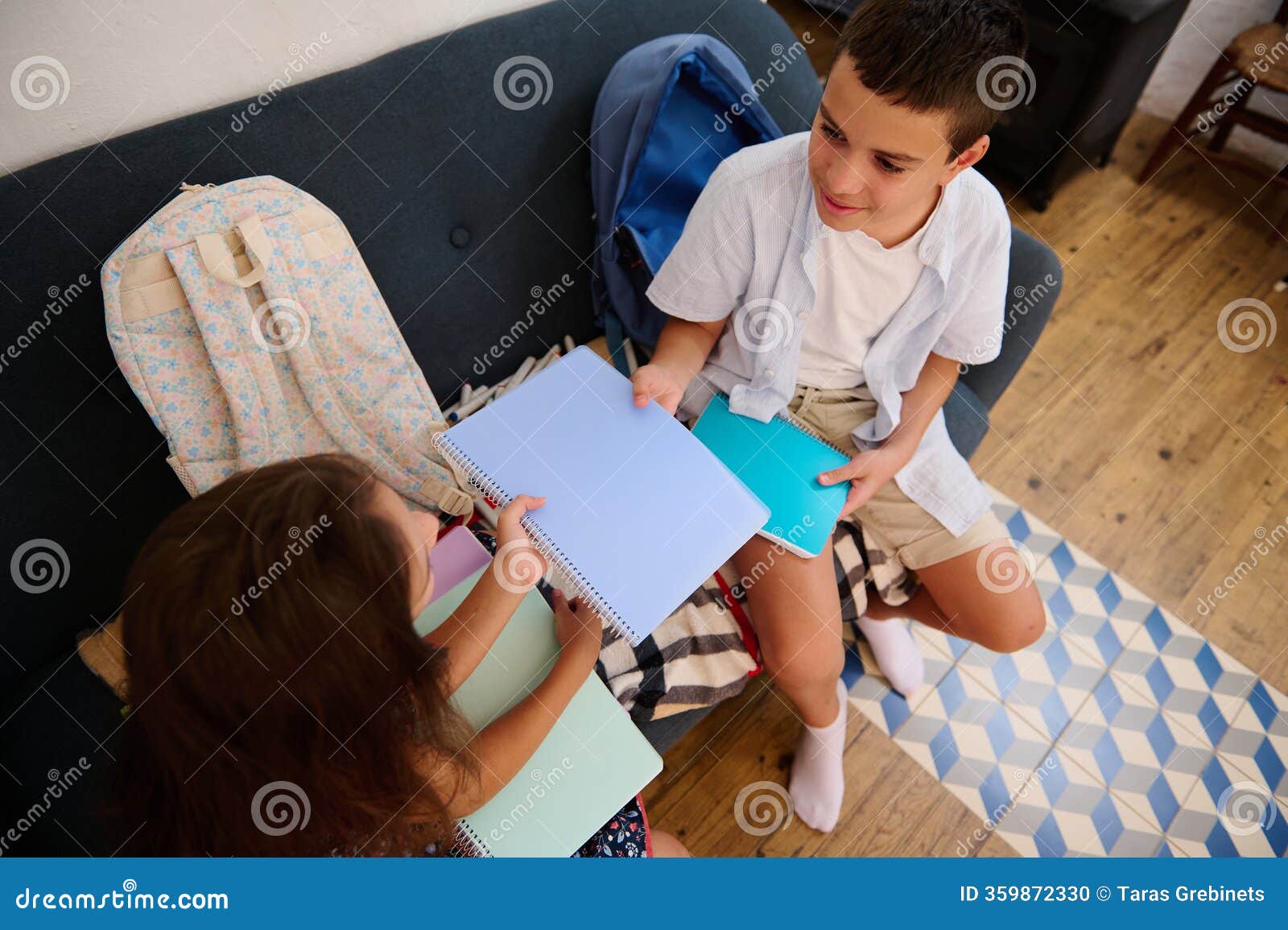Two Children Sharing Notebooks Stock Photo - Image of helping, family ...