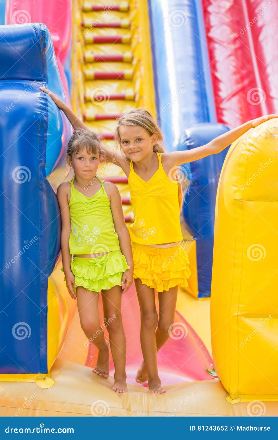 Two Children Stand at Entrance of a Large Inflatable Trampoline Stock ...