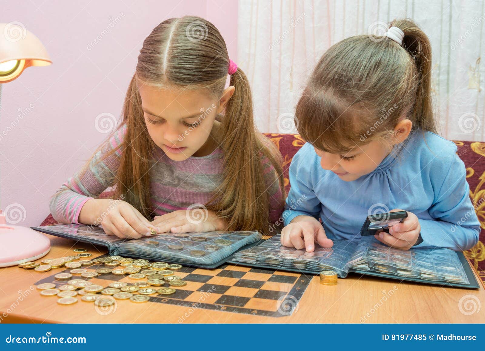 Two Children Studying Coins Album Stock Image - Image of numismatist ...