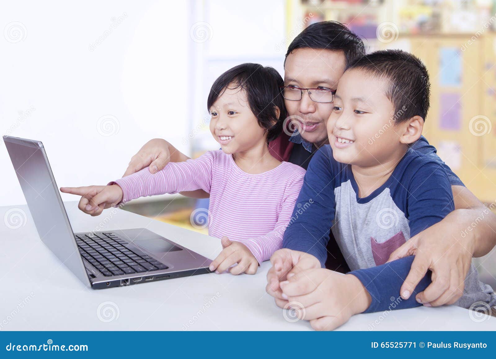 Two Children Using Laptop with Teacher in Class Stock Image - Image of ...