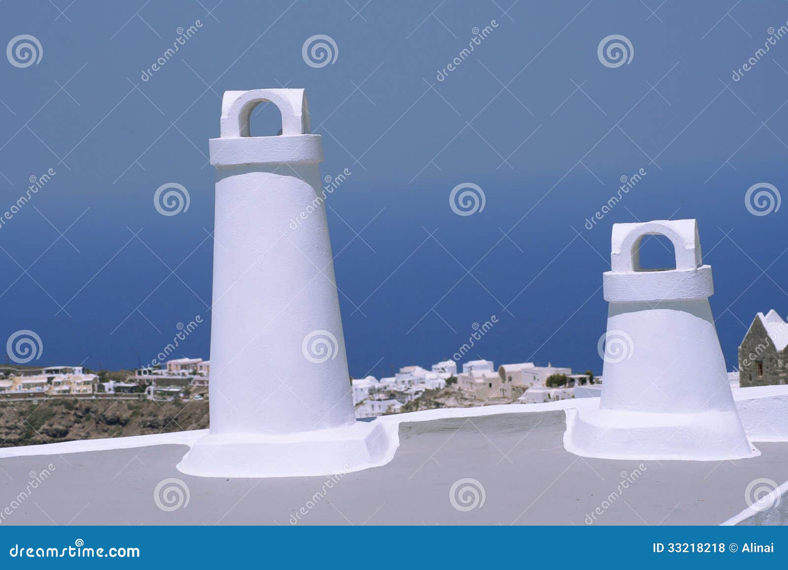 Two chimneys in Santorini stock photo. Image of getaway - 33218218