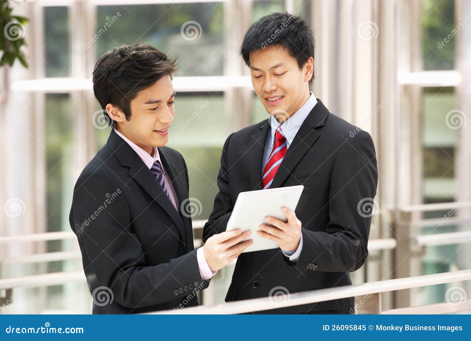 Two Chinese Businessmen Using Tablet Computer Stock Image - Image of ...