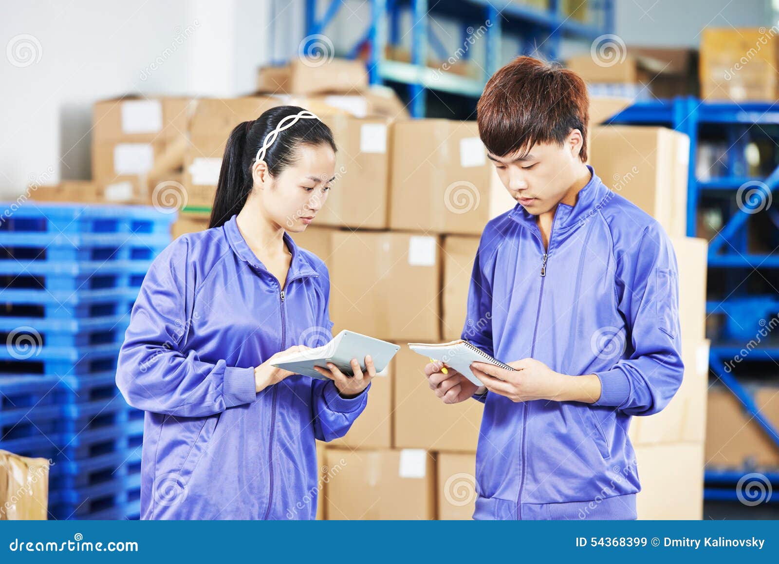 Two Chinese Female Workers in Warehouse Stock Image - Image of lifting ...