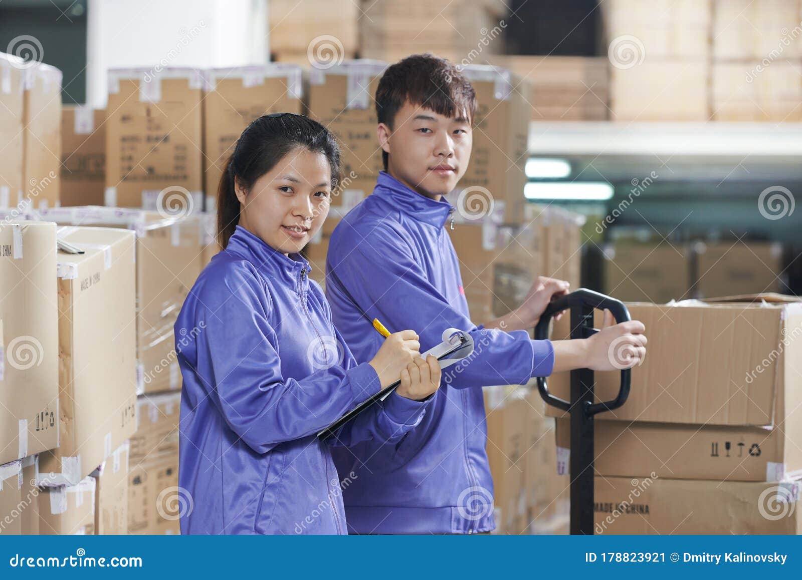 Chinese Warehouse Worker With Forklift Stacker Royalty-Free Stock Photo ...