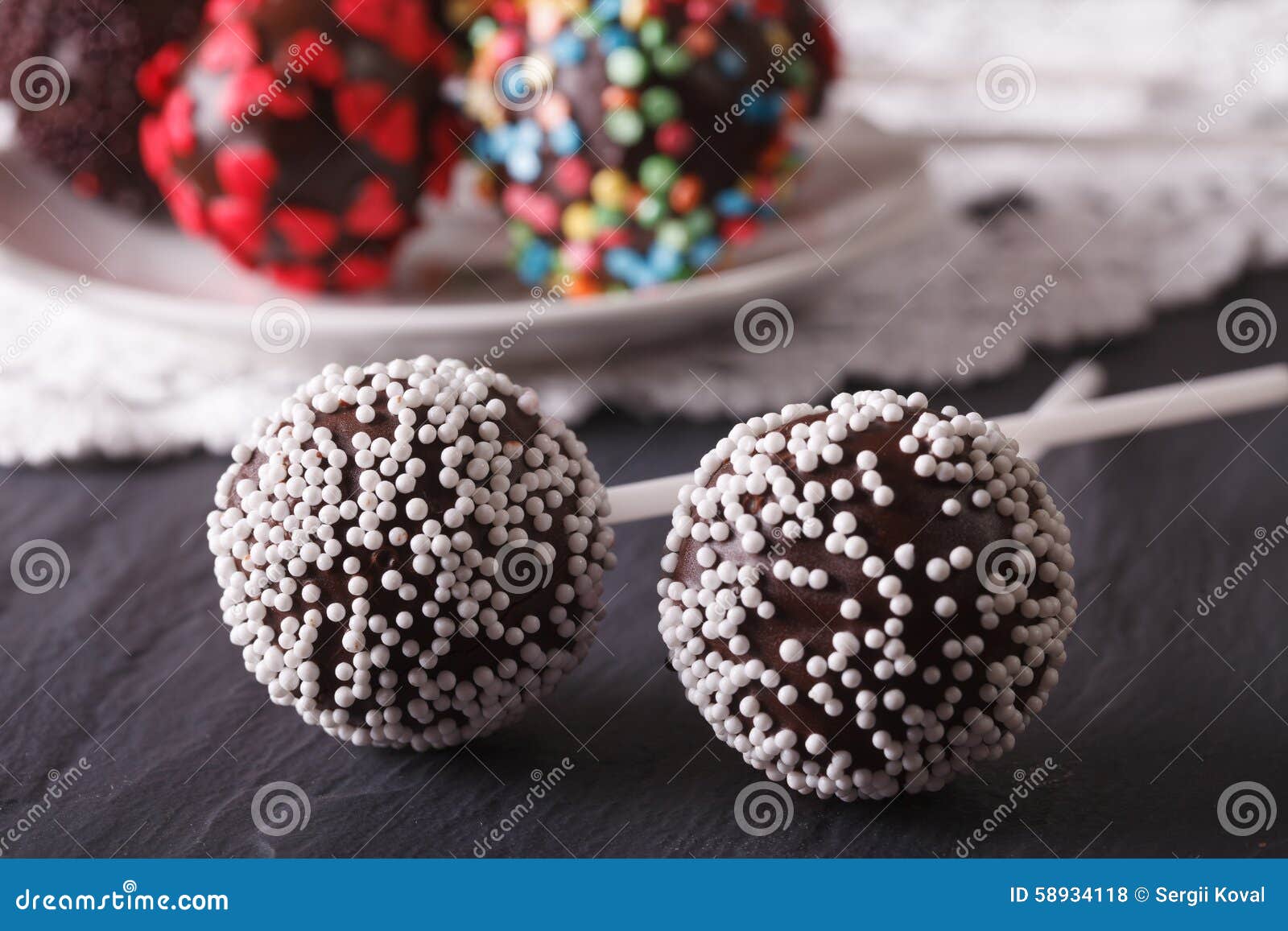 Two Chocolate Cake Pops with White Candy Sprinkles Close-up. Hor Stock ...