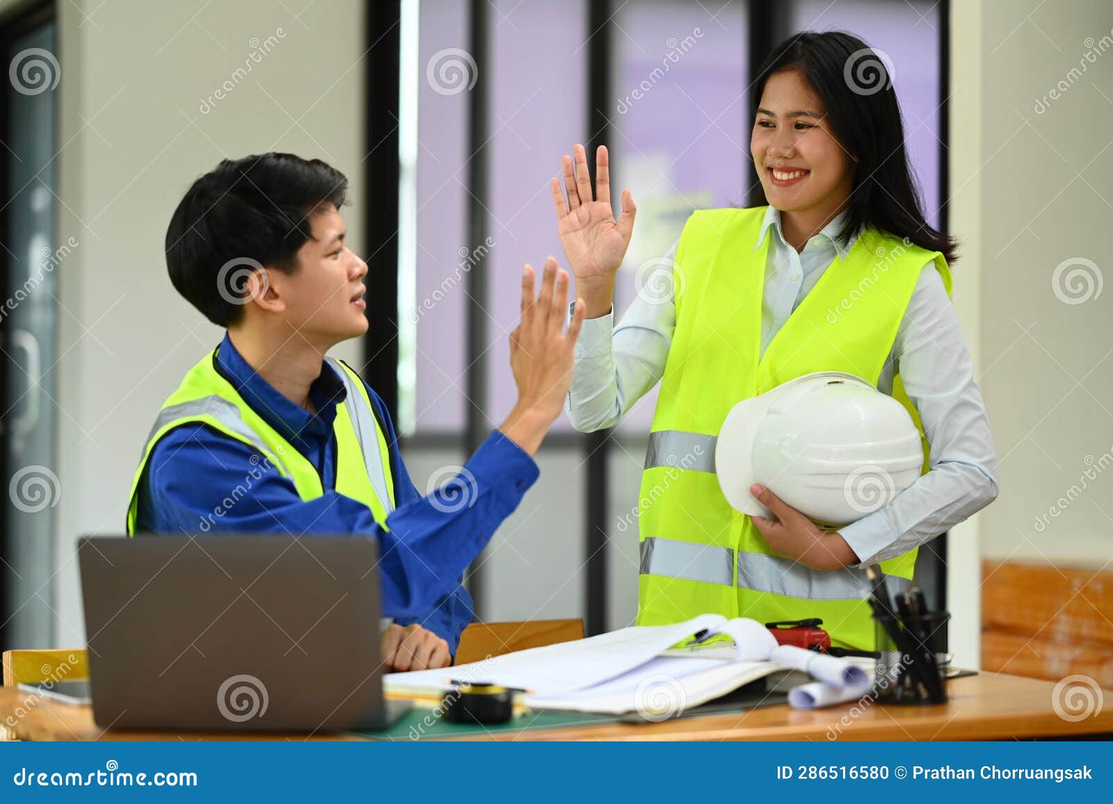 Two Civil Engineer Giving Each Other High Five, Celebrating for ...