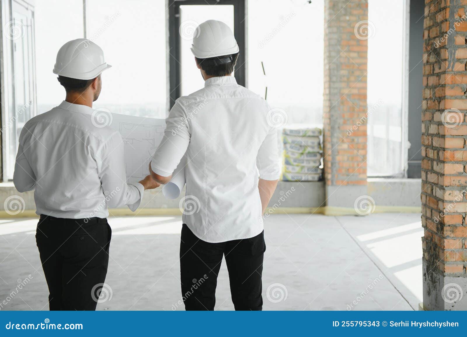 Two Civil Engineers or Architects Man Inspecting Construction of House ...