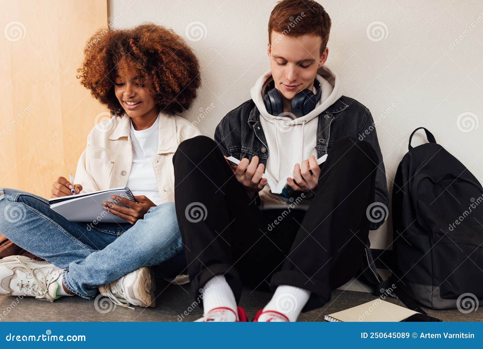 Two Classmates Sitting at Wall in School. Students Preparing Their ...