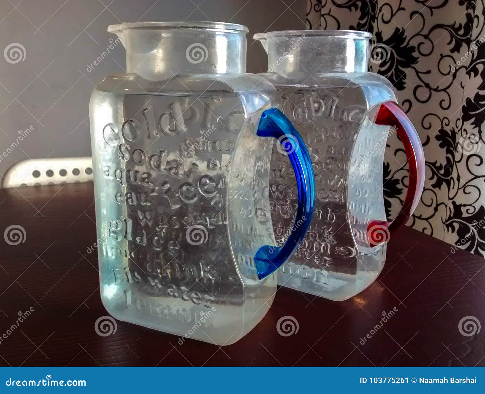 Two Full Water Pitchers on Table Stock Image - Image of languages ...