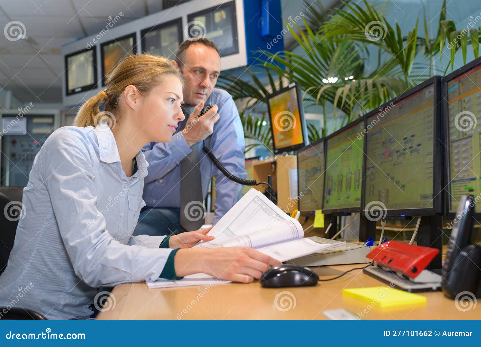 Two Co-workers Discussing Papers in Tv Studio Stock Photo - Image of ...