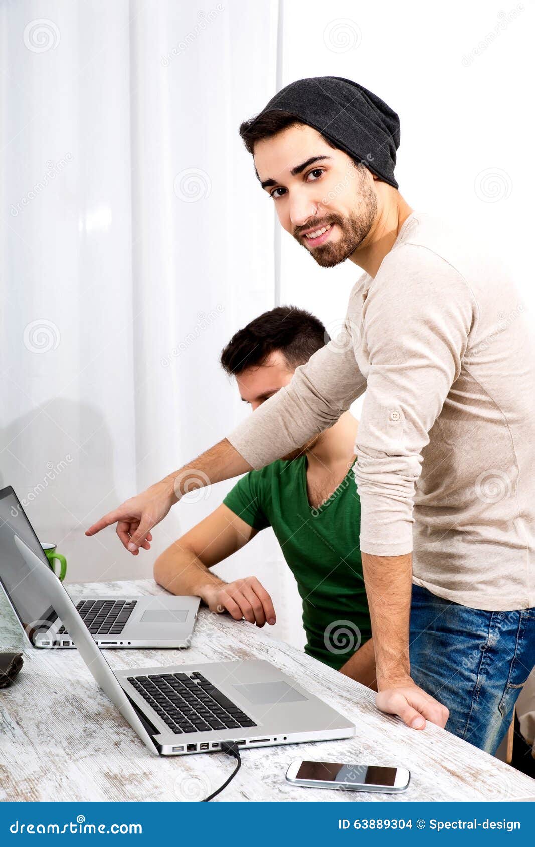 Two Co-workers Discussing Something in the Office Stock Photo - Image ...
