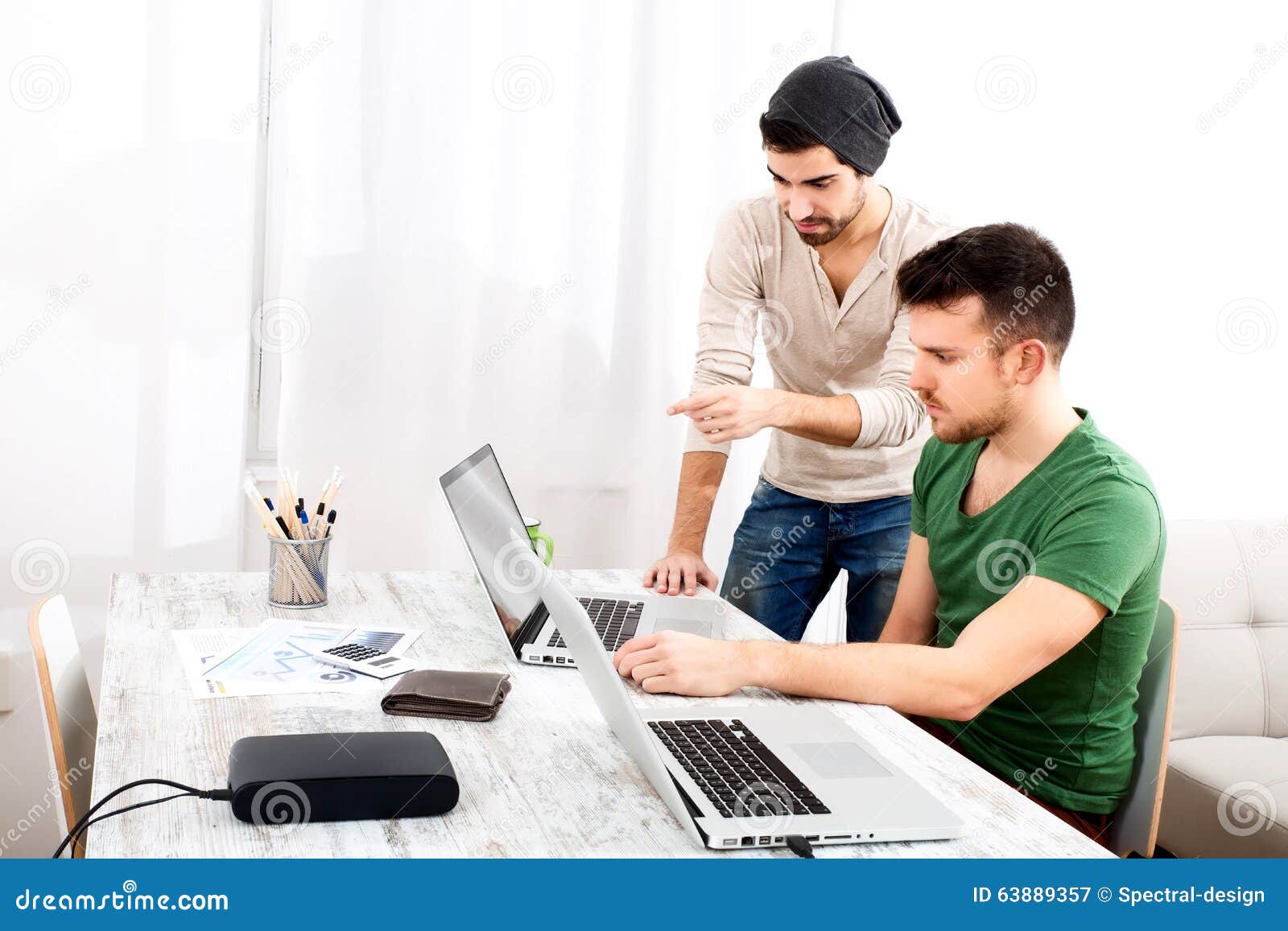 Two Co-workers Discussing Something in the Office Stock Image - Image ...