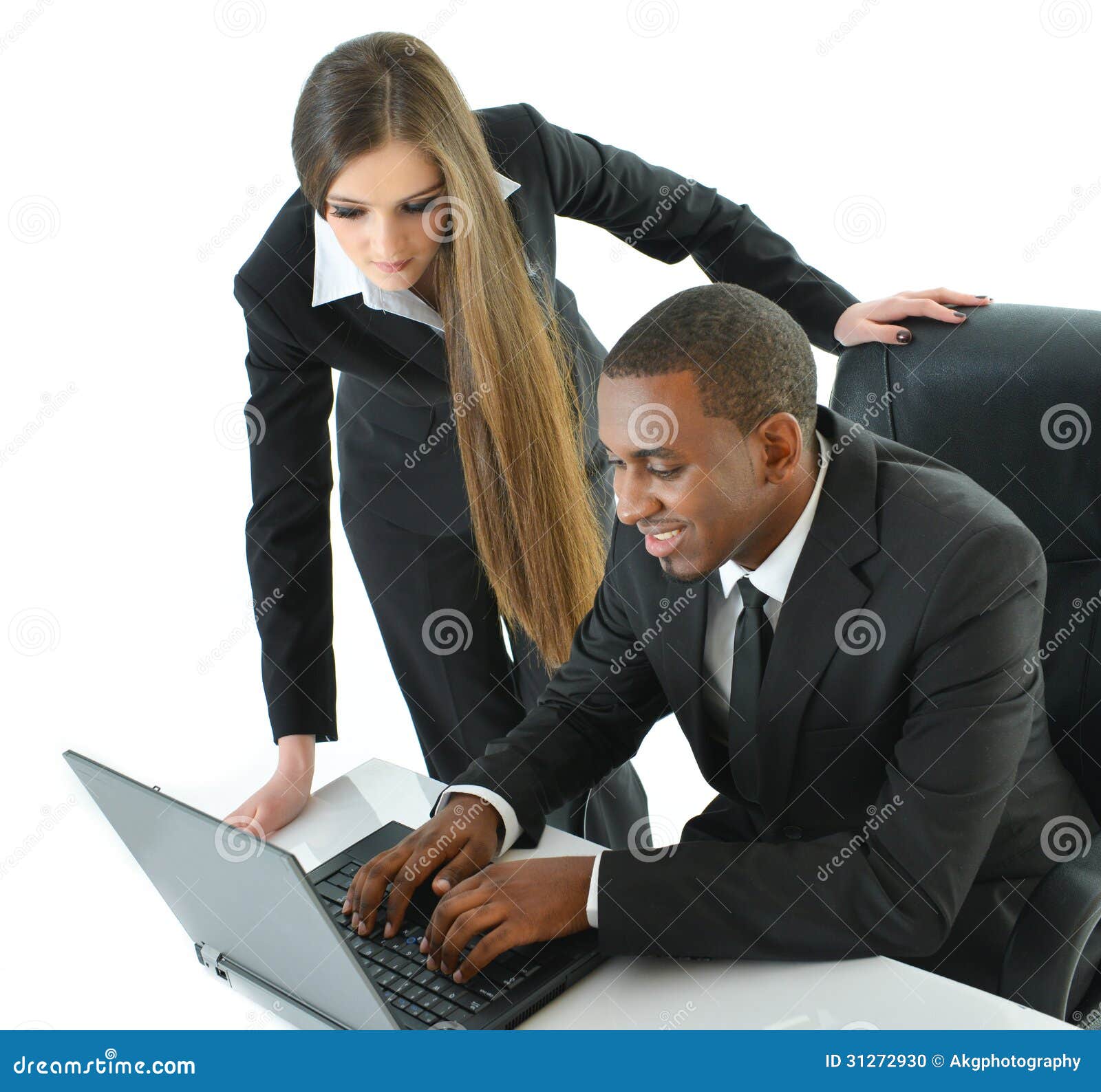 Two Co-Workers on Laptop stock photo. Image of smile - 31272930