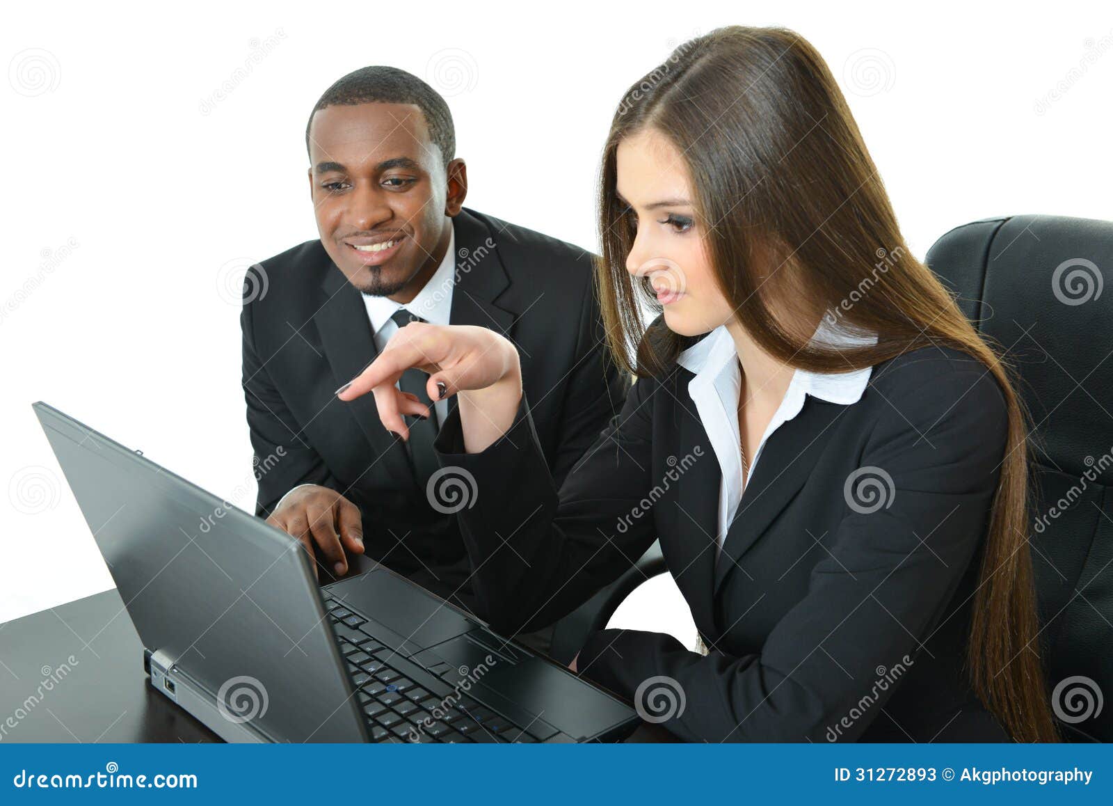 Two Co-Workers Looking at Laptop Stock Image - Image of minority ...