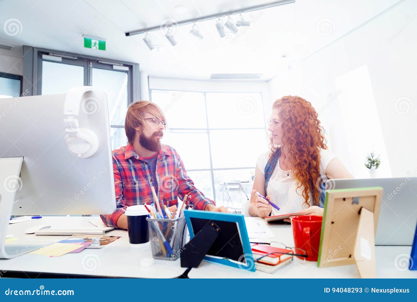 Two Co-workers Working Together Stock Image - Image of coworking, desk ...