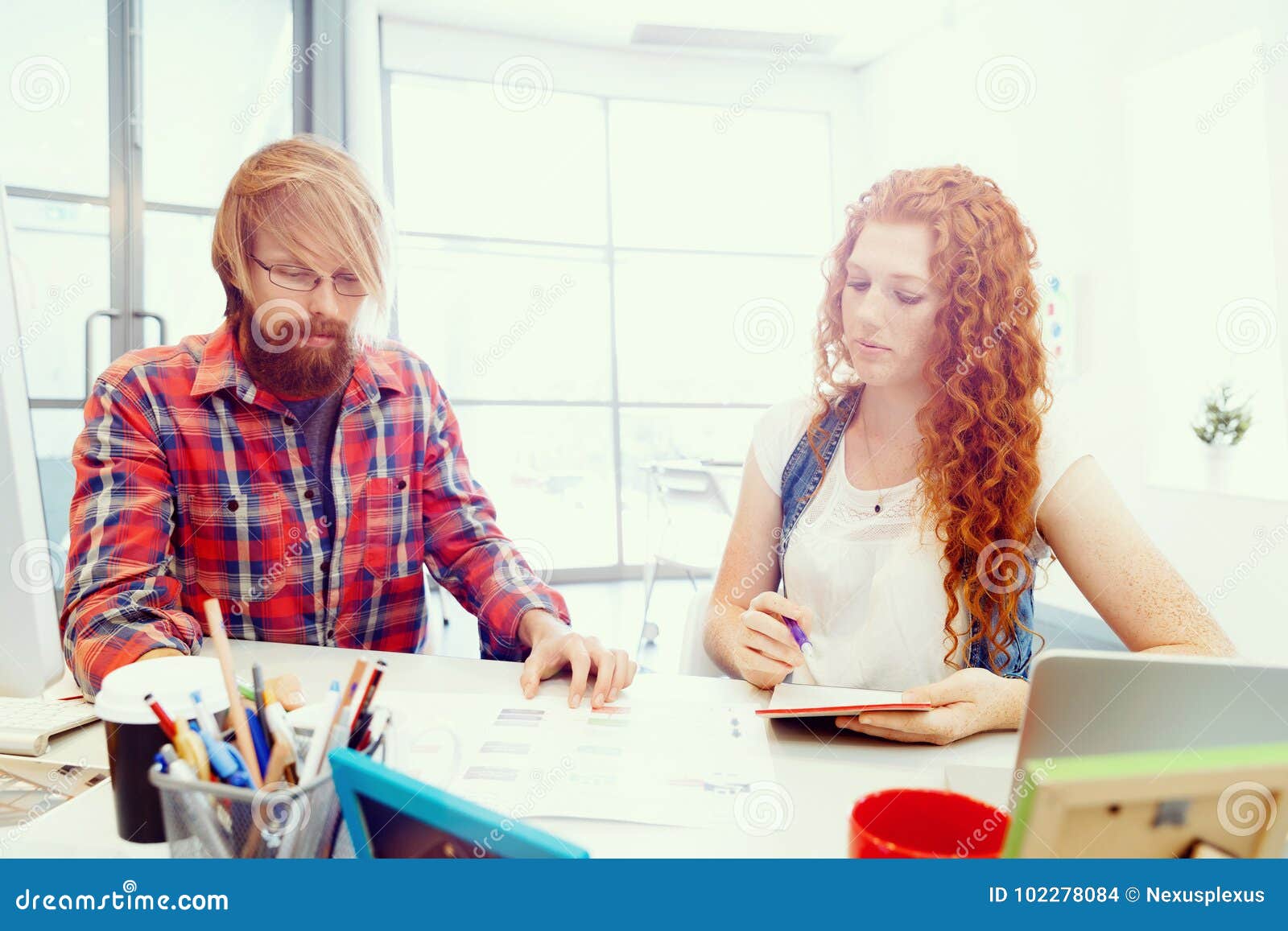 Two Co-workers Working Together Stock Photo - Image of designer, desk ...