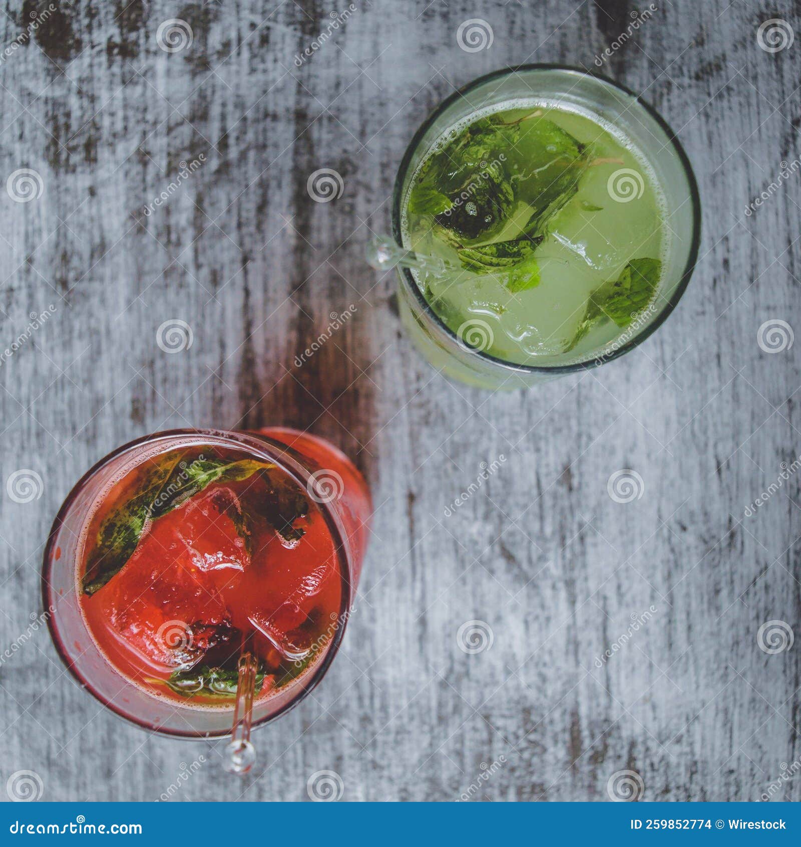 Two Cocktails, One Red and One Green, 2x1, Served on a Rustic Wooden ...