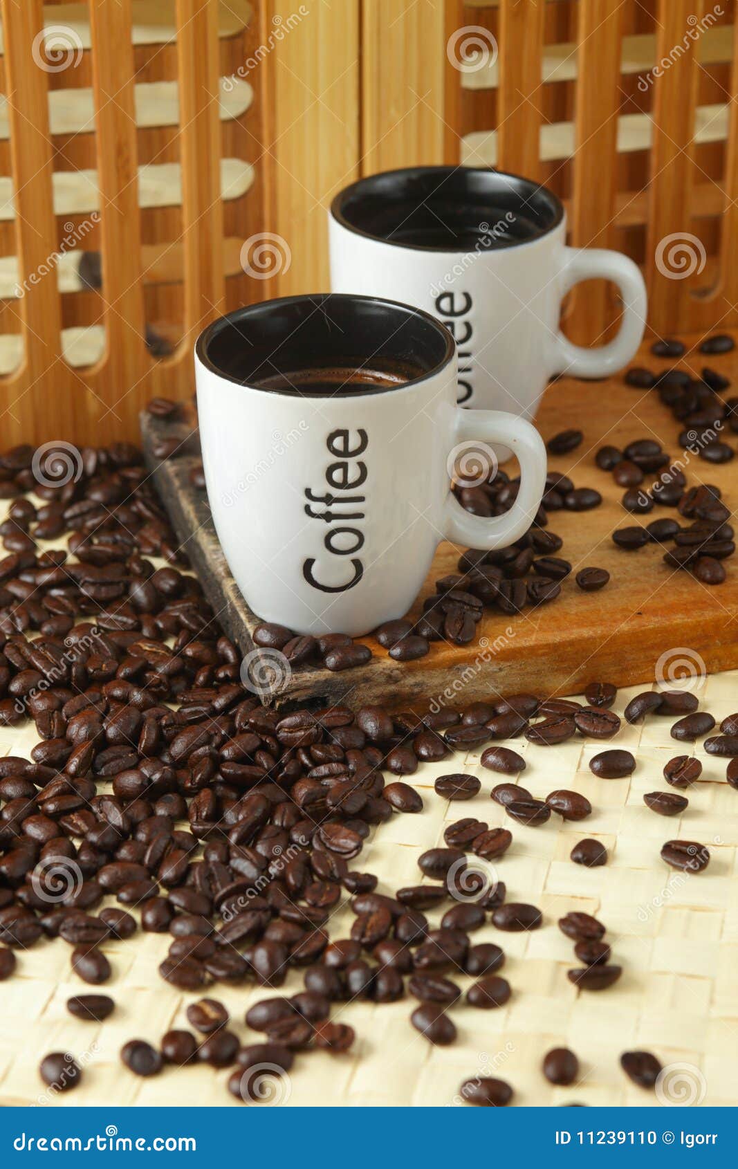 Two coffee cups stock photo. Image of indoors, wood, wicker - 11239110
