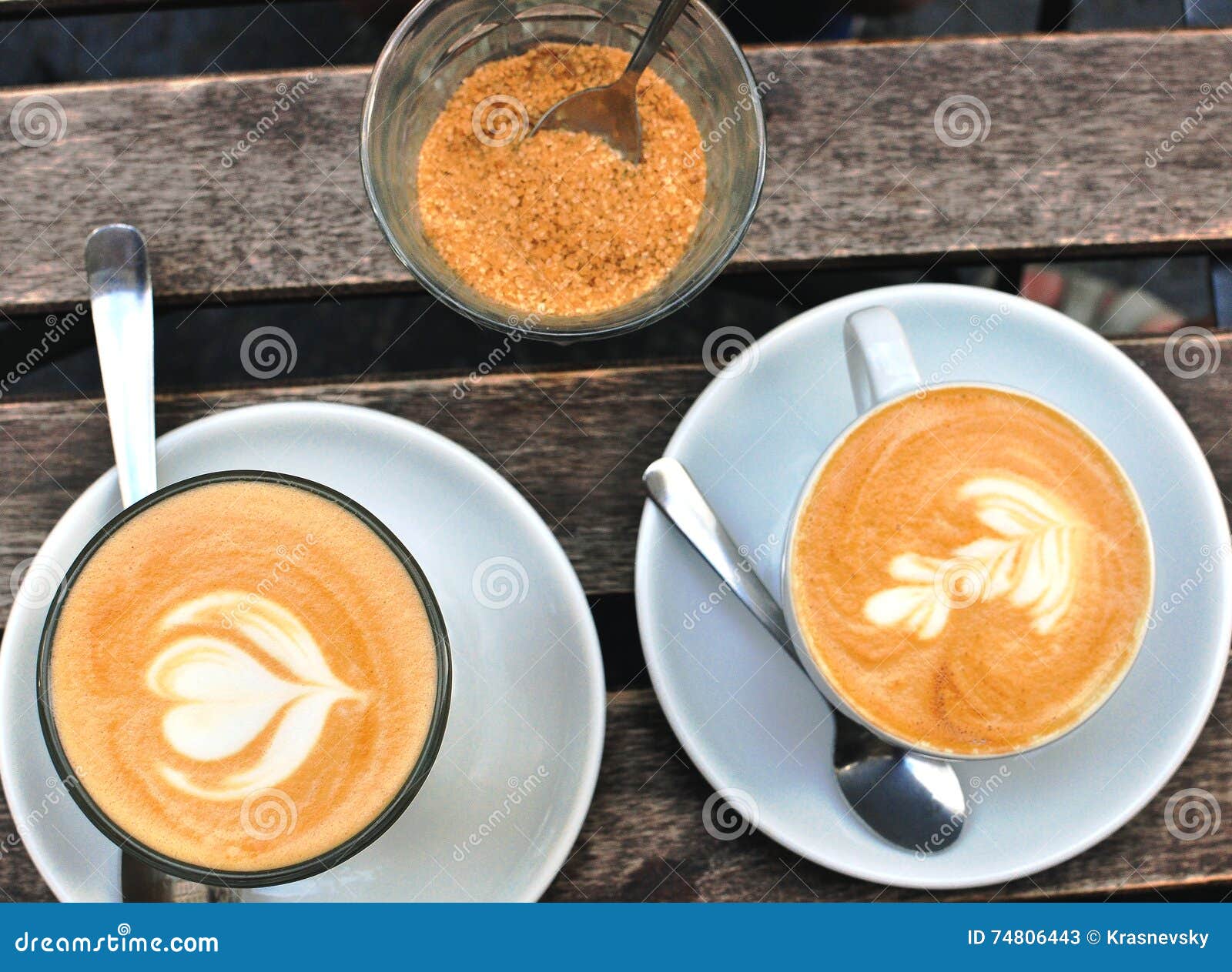 Two coffee cups on table stock image. Image of capucino - 74806443