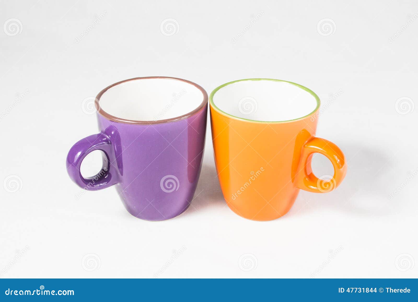 Two coffee mugs 01 stock photo. Image of purple, orange - 47731844