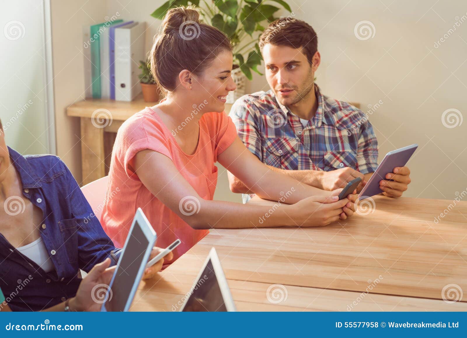 Two Colleague Discussing with Their Digital Devices Stock Photo - Image ...
