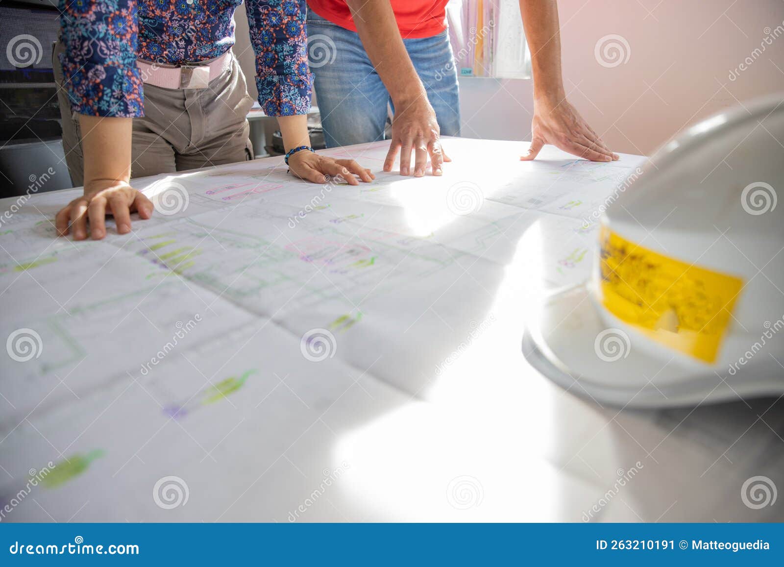 Two Colleagues Analyze a Technical Drawing while in the Office Stock ...