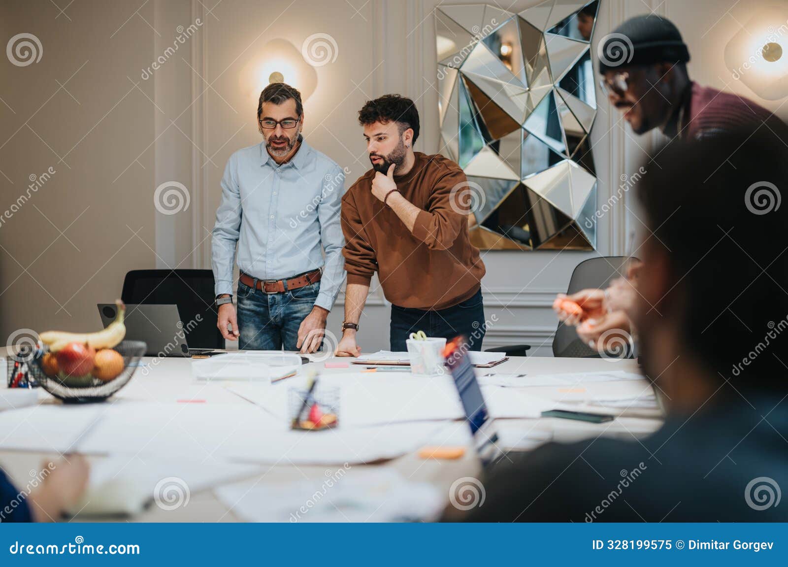 Multi Generational Team Engaged in a Creative Business Meeting in a ...