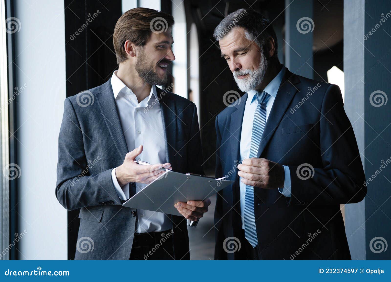 Two Colleagues Communicating in Corridor, Partners Walking in the ...